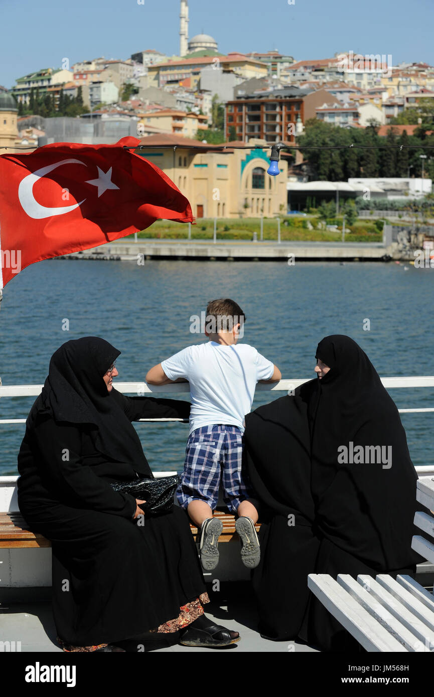 TURKEY Istanbul, Golden Horn, two veiled muslim women with child at ...