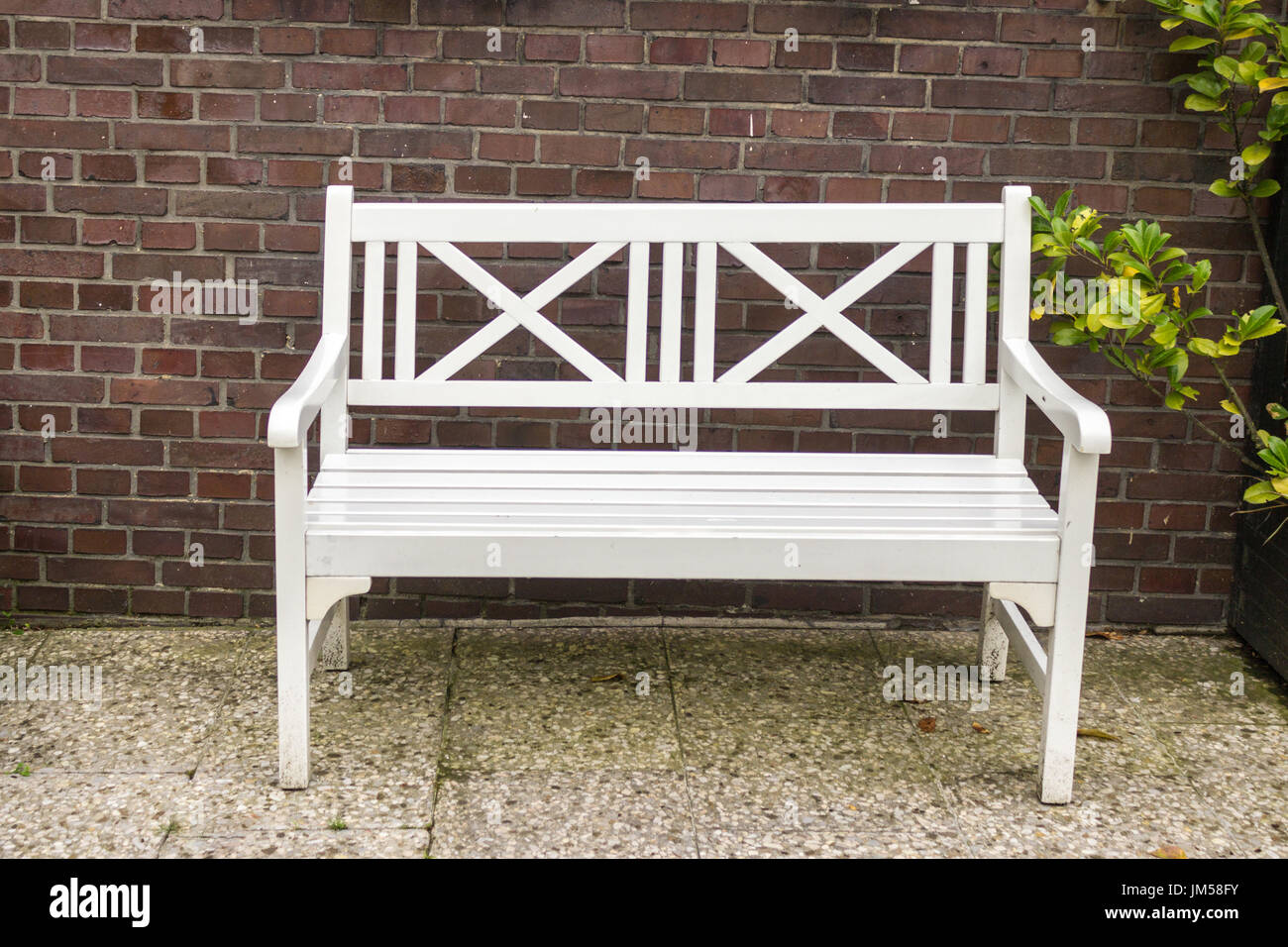 Bench in front of brick house hi-res stock photography and images - Alamy