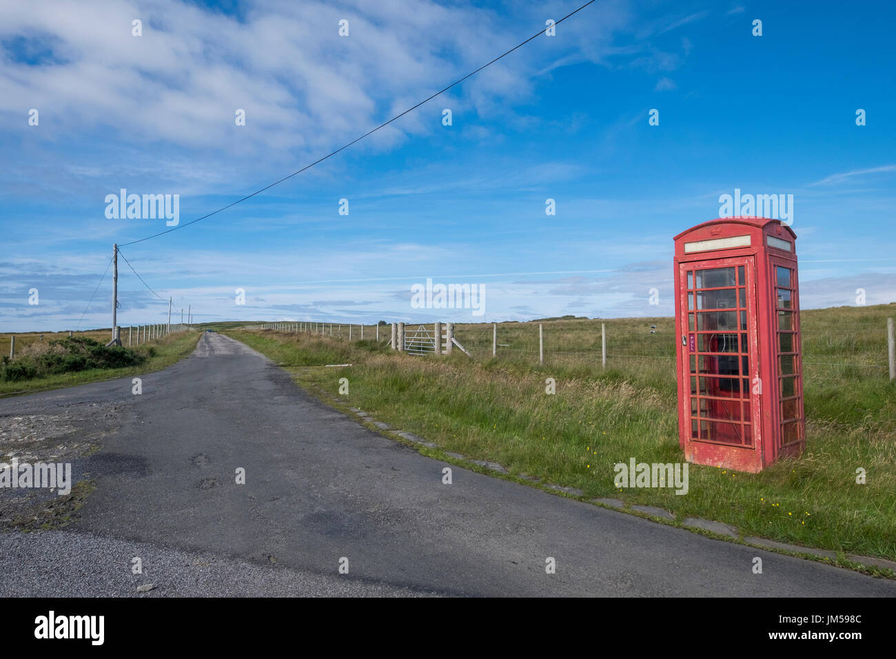 A traditional British red telephone box in a remote location Stock ...