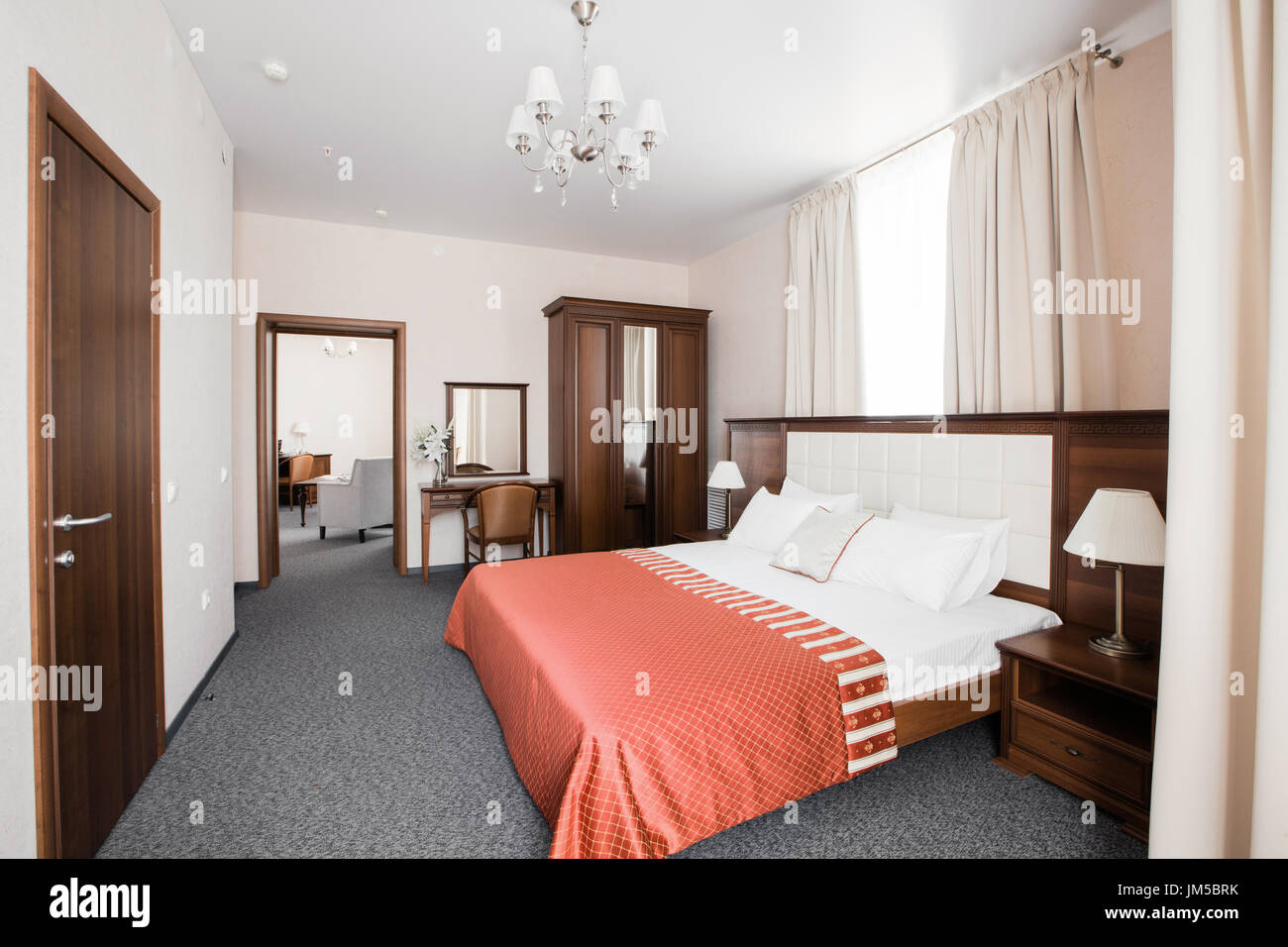 Hotel apartment, bedroom interior in the morning. two-room Suite, with ...