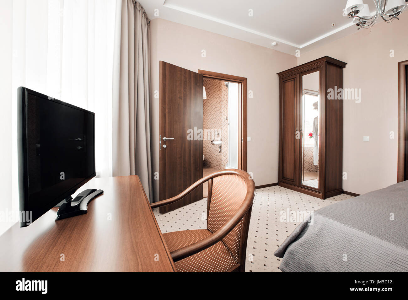 Hotel apartment, bedroom interior in the morning Stock Photo - Alamy
