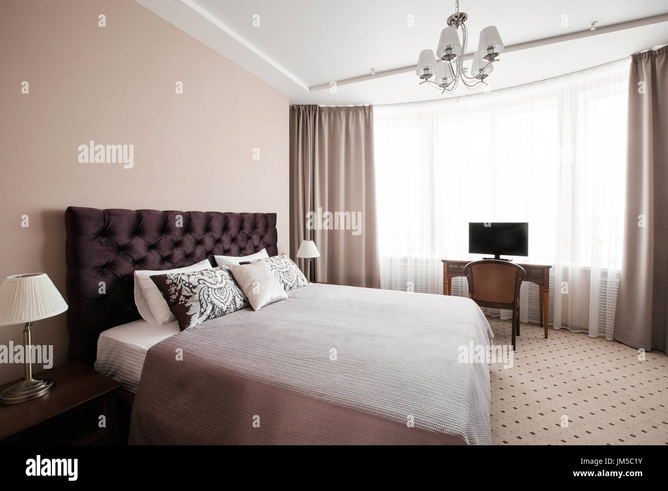 Hotel apartment, bedroom interior in the morning Stock Photo - Alamy