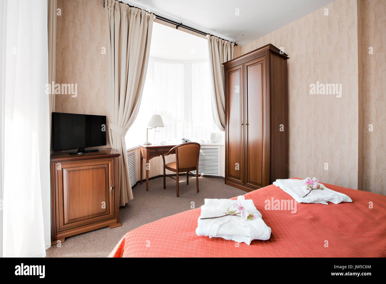 Hotel apartment, bedroom interior in the morning Stock Photo - Alamy