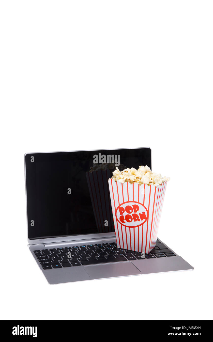 Open laptop with tub of popcorn sitting on the keyboard - movie ...
