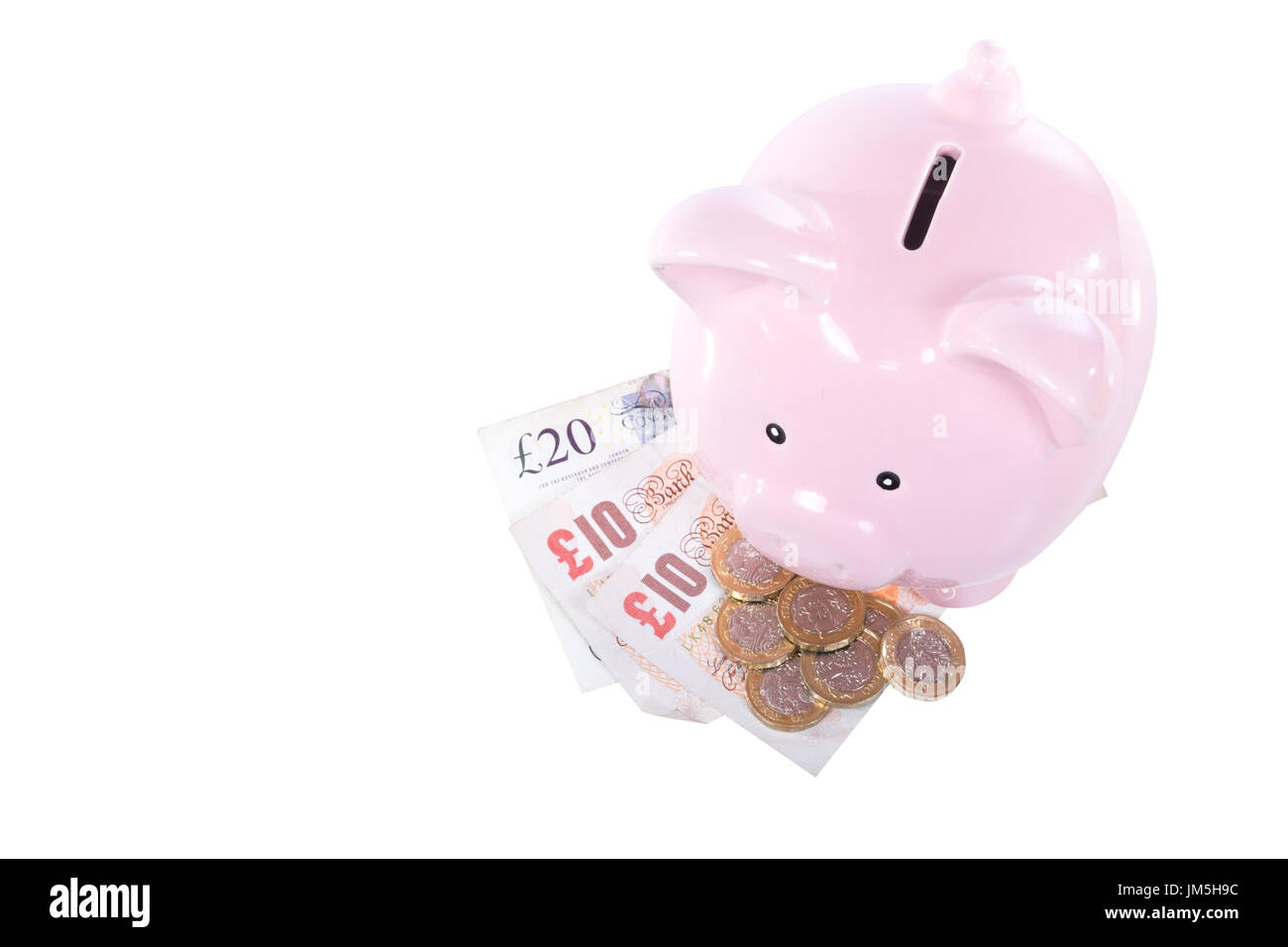 Cash money saving concept with small cute pink piggy bank and some ...