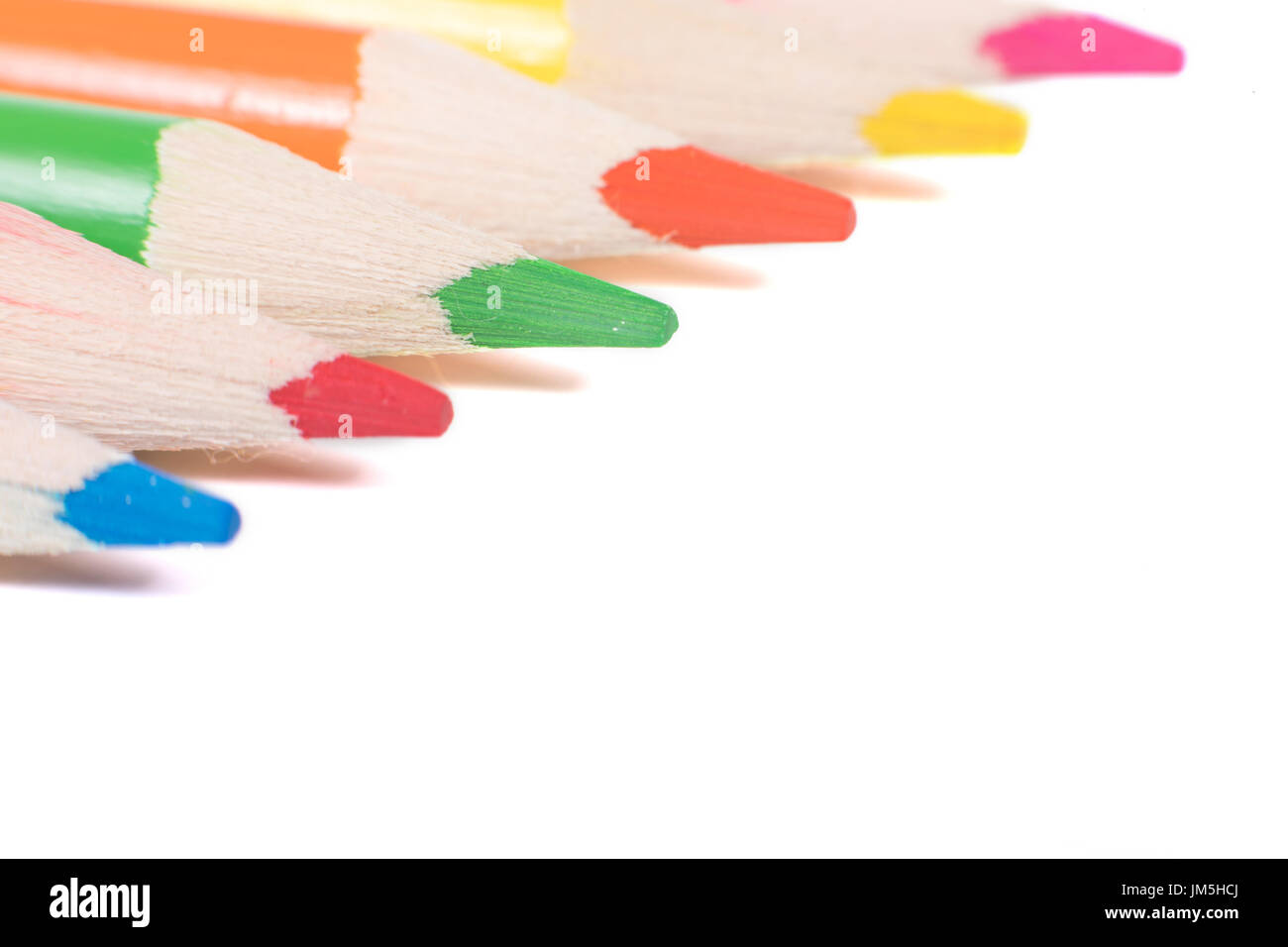 Colored pencils isolated on white background arranged in diagonal ...