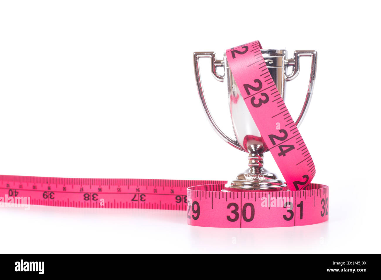 Measuring tape and small sports cup in detail front view isolated on ...