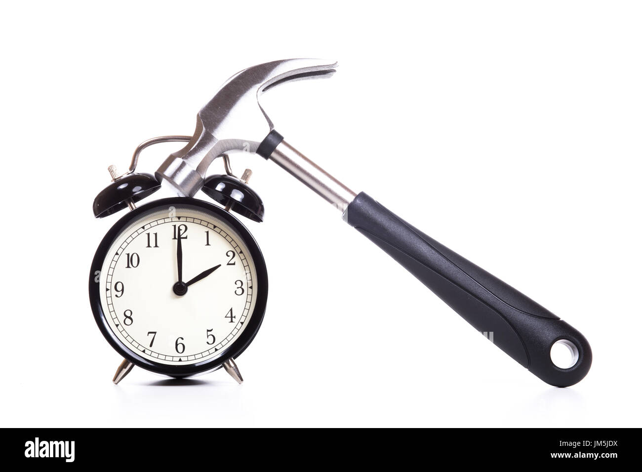 Classic alarm clock and hammer tool isolated on white background with ...