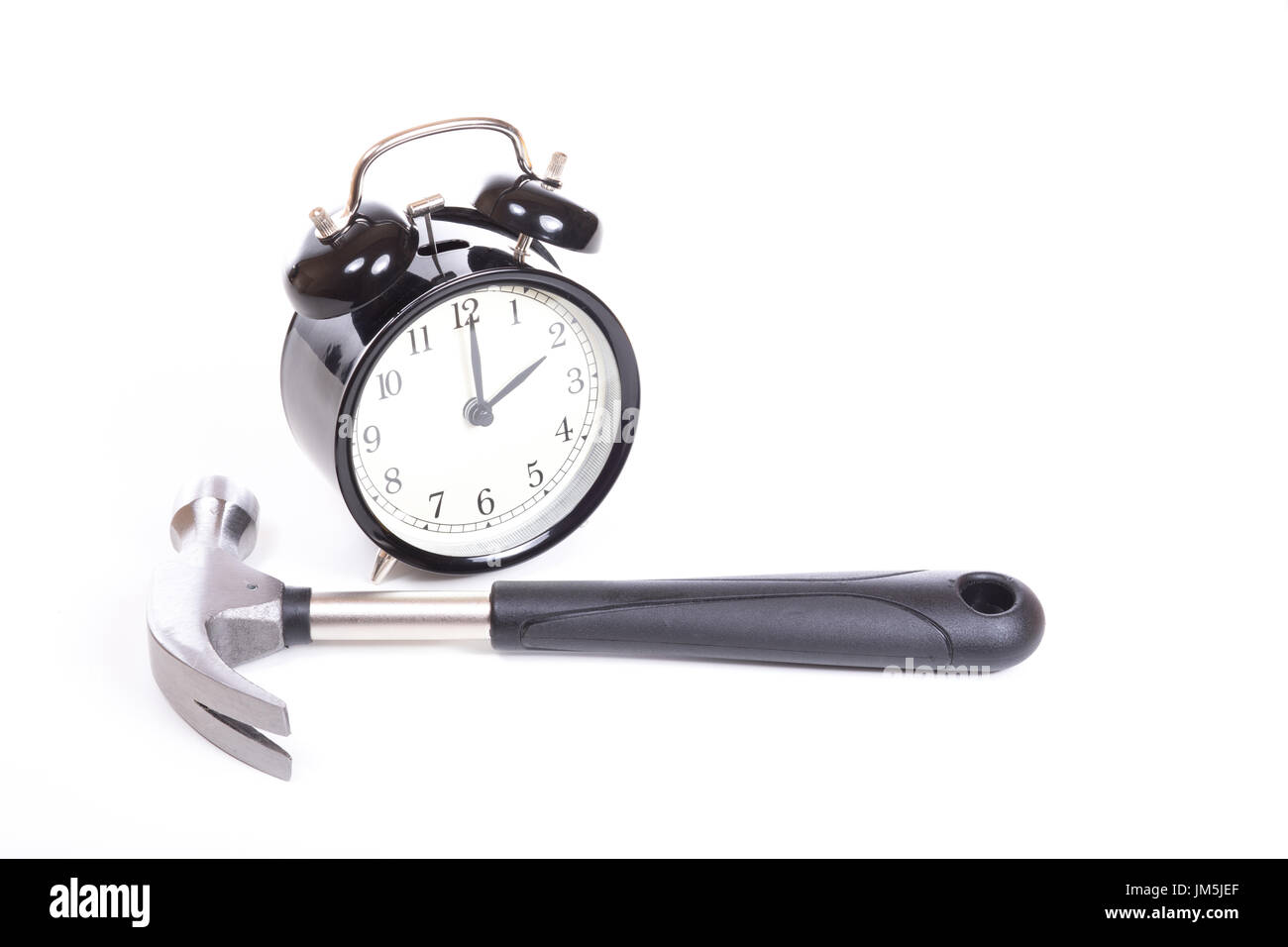 Alarm clock and hammer tool isolated on white background with copy ...