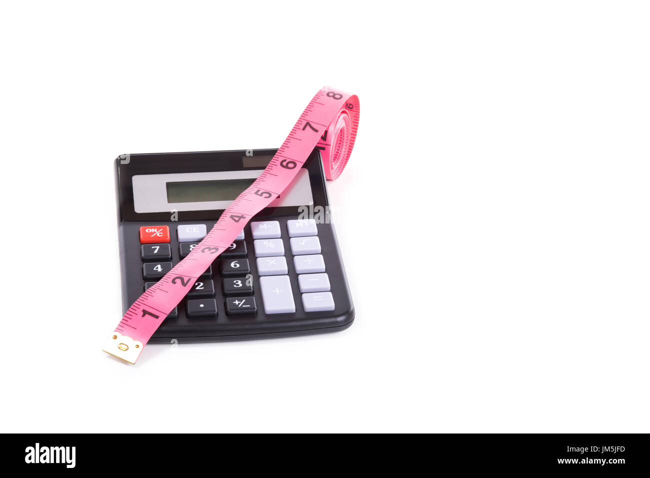Roll of measuring tape over simple black calculator isolated on white ...