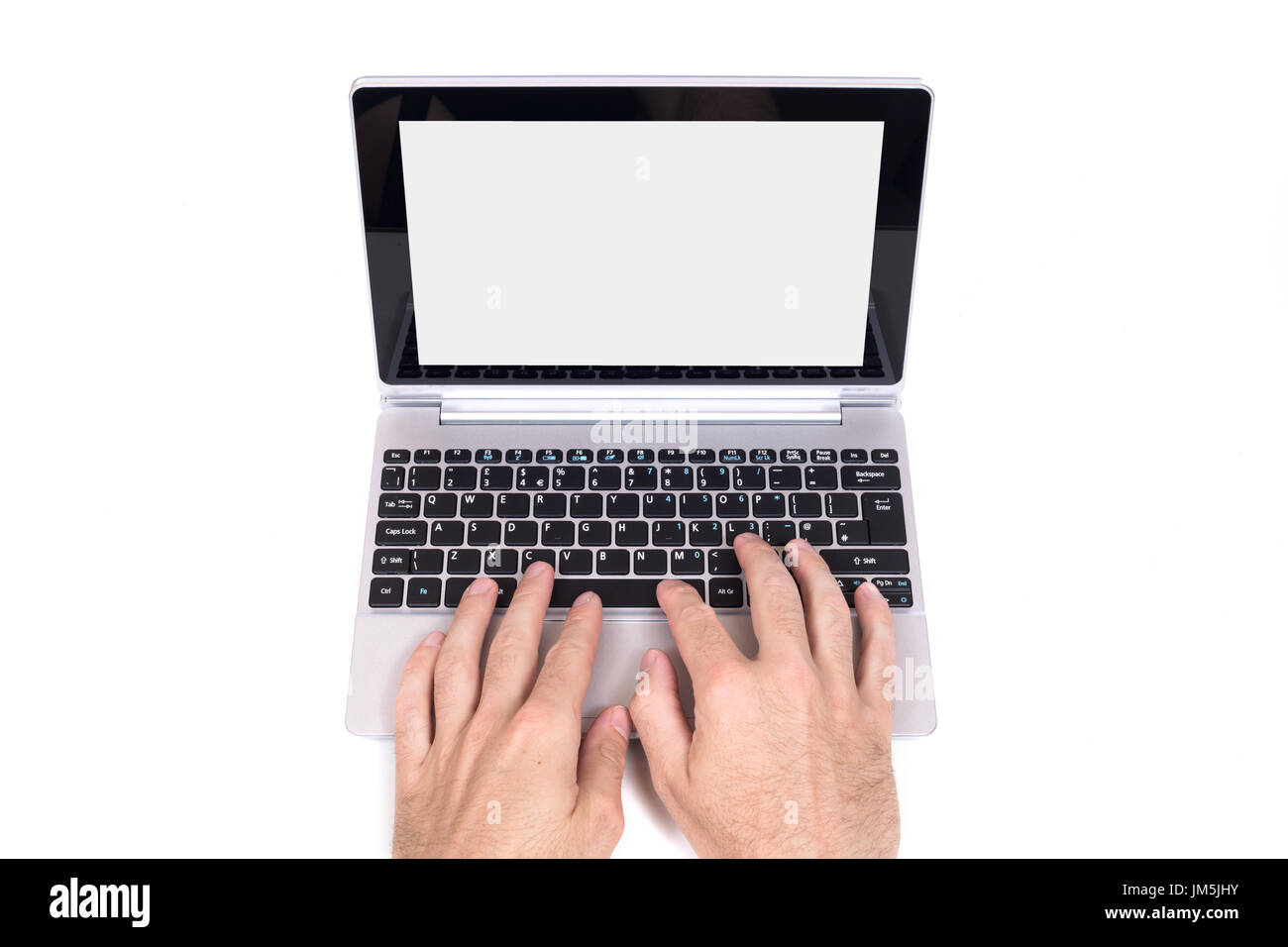 Man hands over laptop computer keyboard with blank white display ...