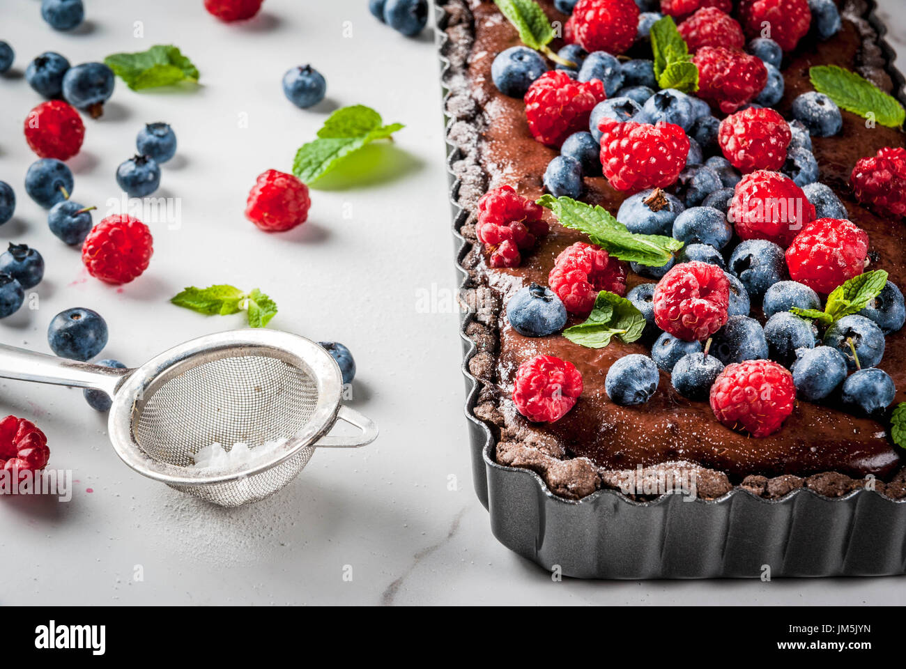Summer homemade baked pastry. Chocolate cake tart with chocolate cream ...