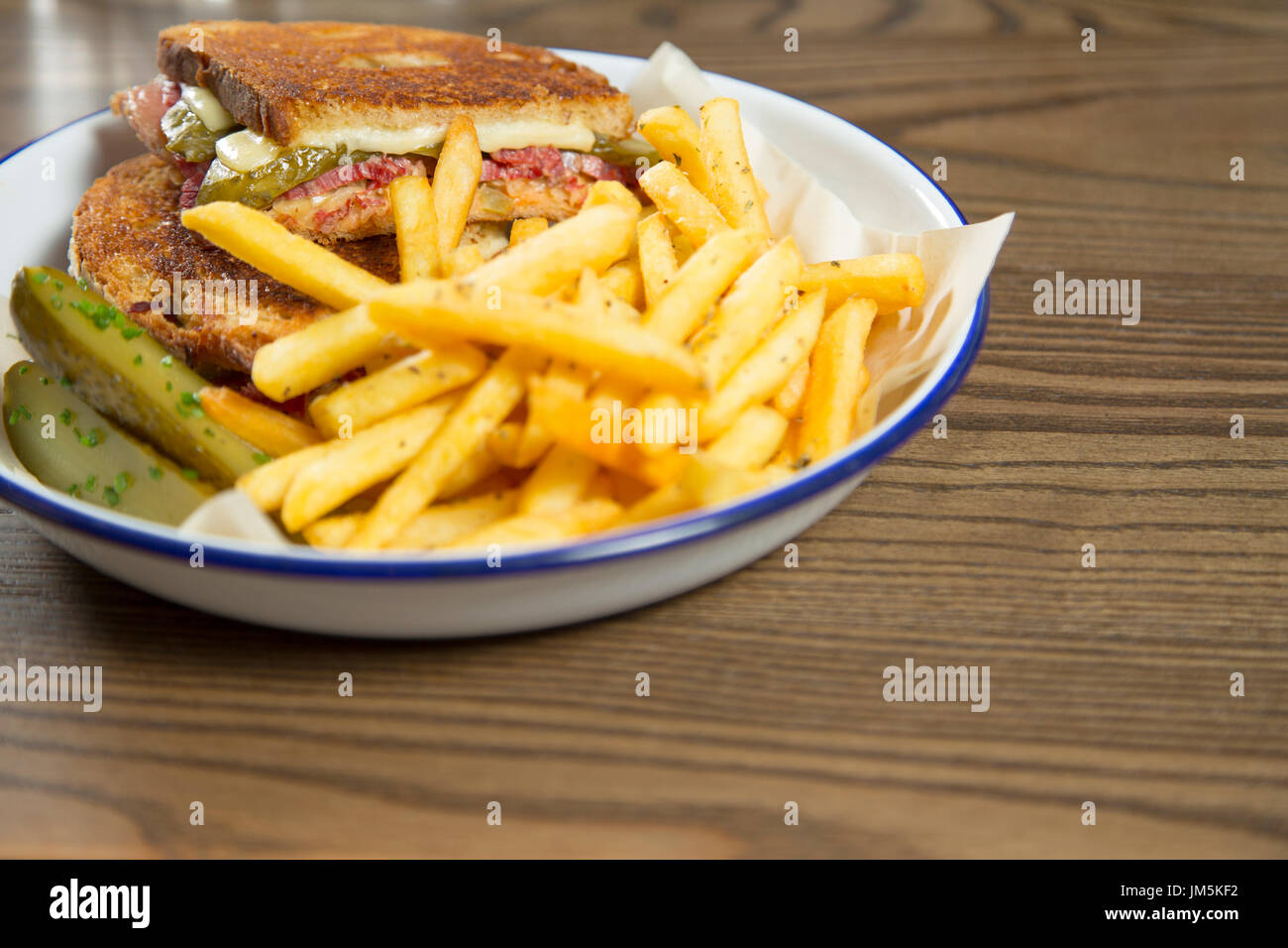 Cheese and ham toasted sandwich with a portion of chips Stock Photo - Alamy