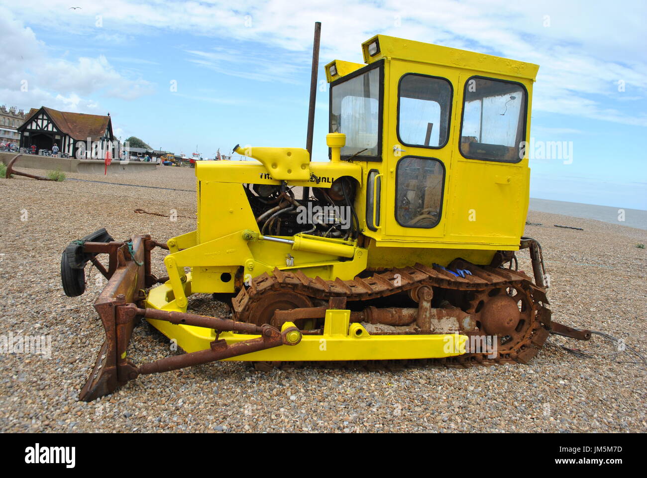 Bright yellow mini catapulted bulldozer on Aldeburge beach Stock Photo ...