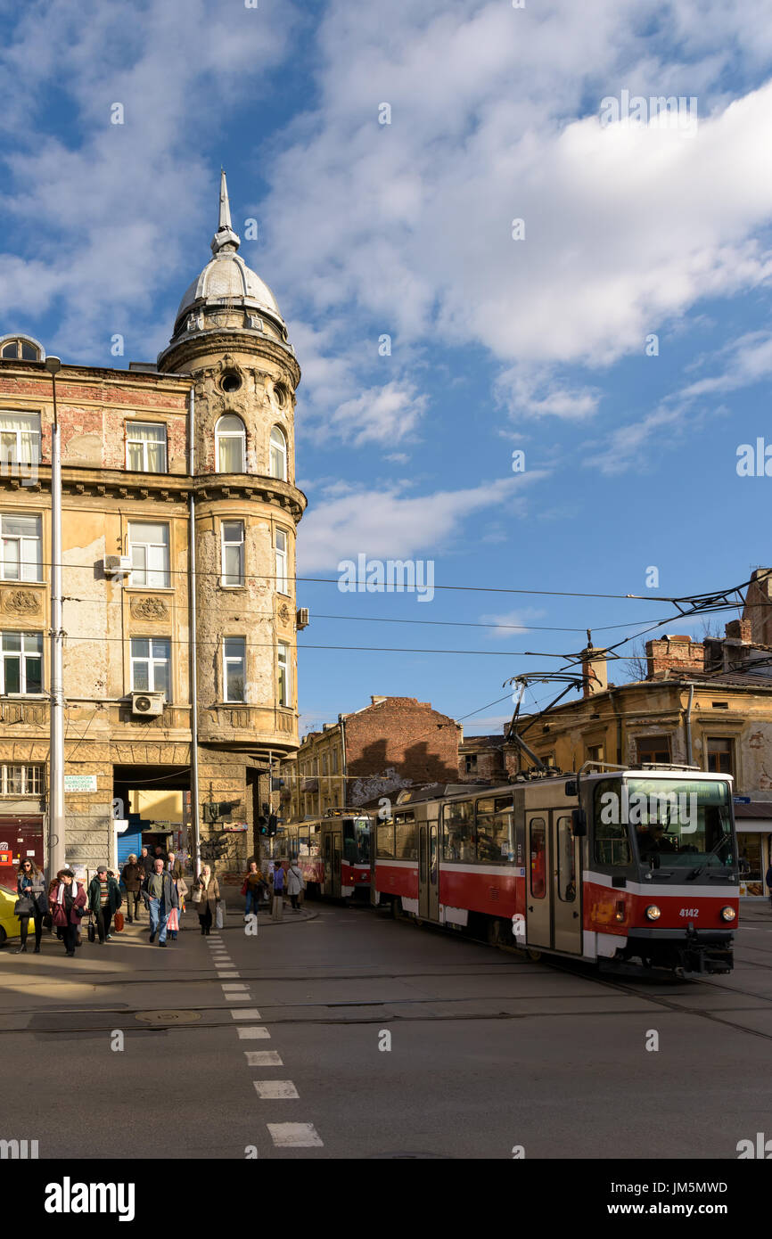 Old traditional building and red tram on the streets of Sofia, Bulgaria ...