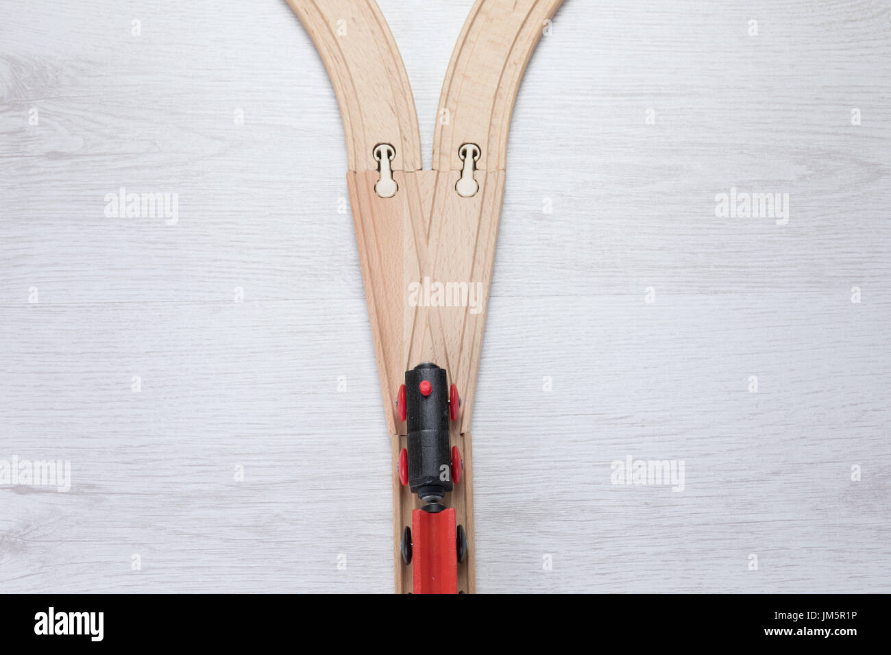Wooden toy train approaching a fork in the line or track viewed from ...