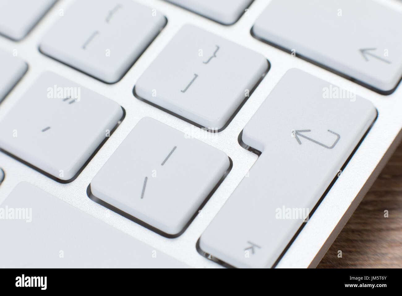 Detail of the keys on a white laptop keyboard with a top view on the ...