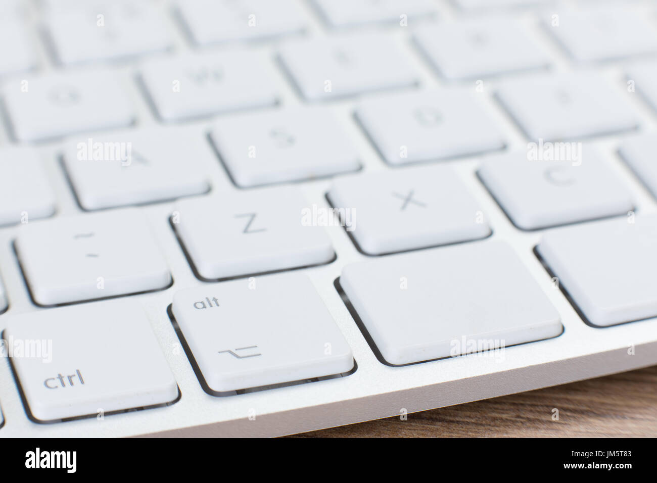 Close up background of a white laptop keyboard with focus to the ...