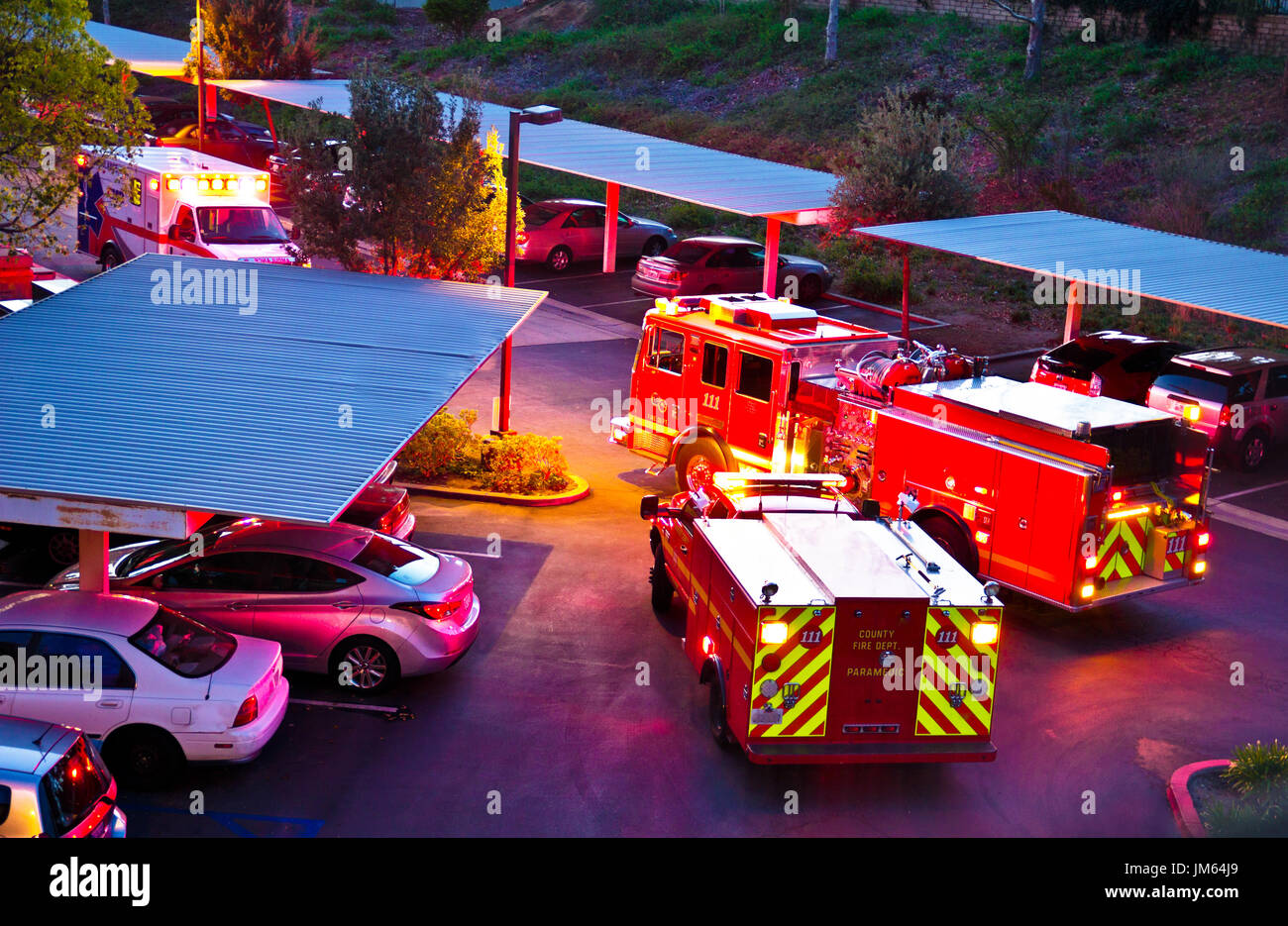 A fire engine and two ambulances respond to a nighttime 911 call for ...