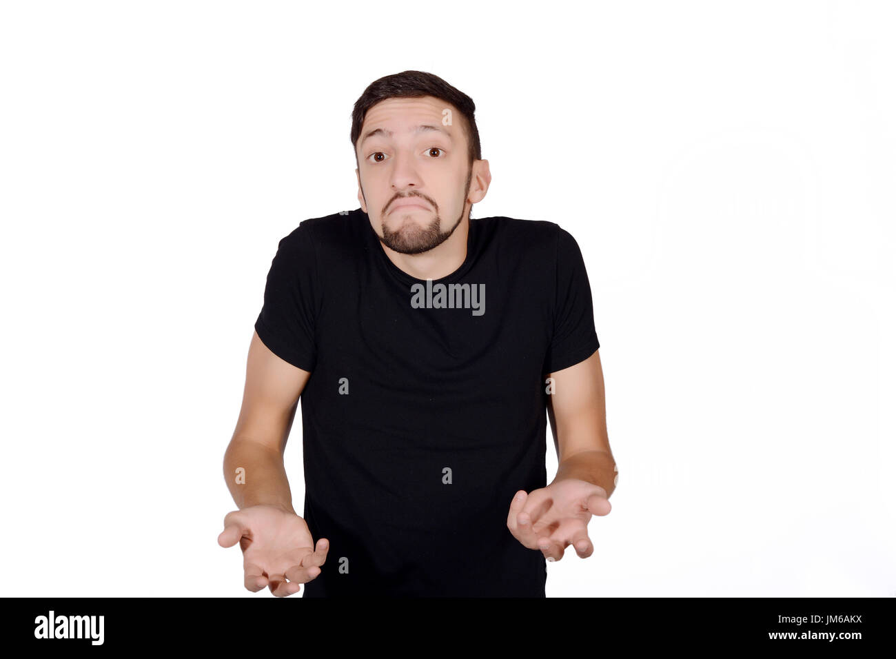 Portrait of a young man who do not understand what is happening ...