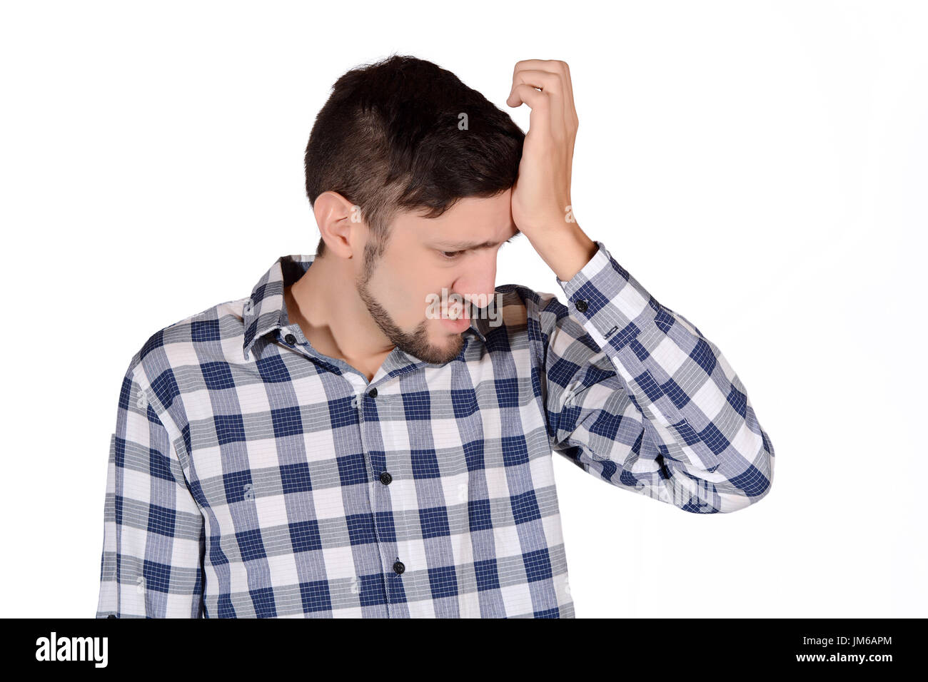Portrait of a young man worried. Isolated white background Stock Photo ...