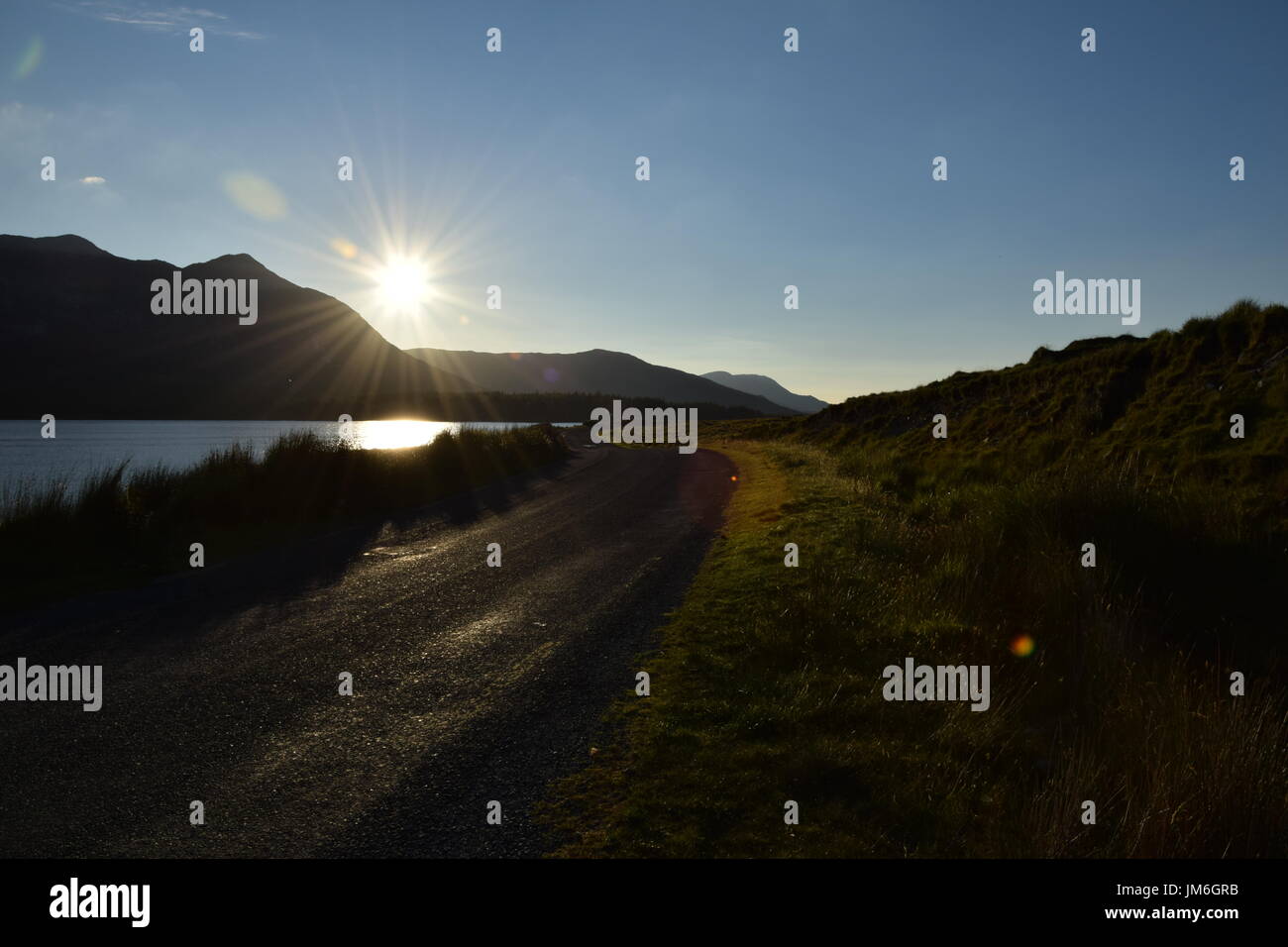 Road next to Lough Inagh lake, Connemara National Park, County Galway ...