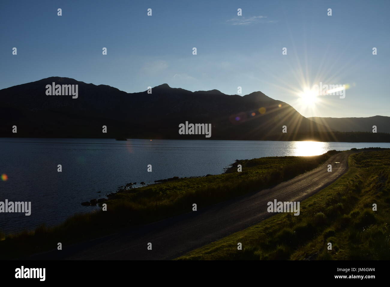 Road next to Lough Inagh lake, Connemara National Park, County Galway ...