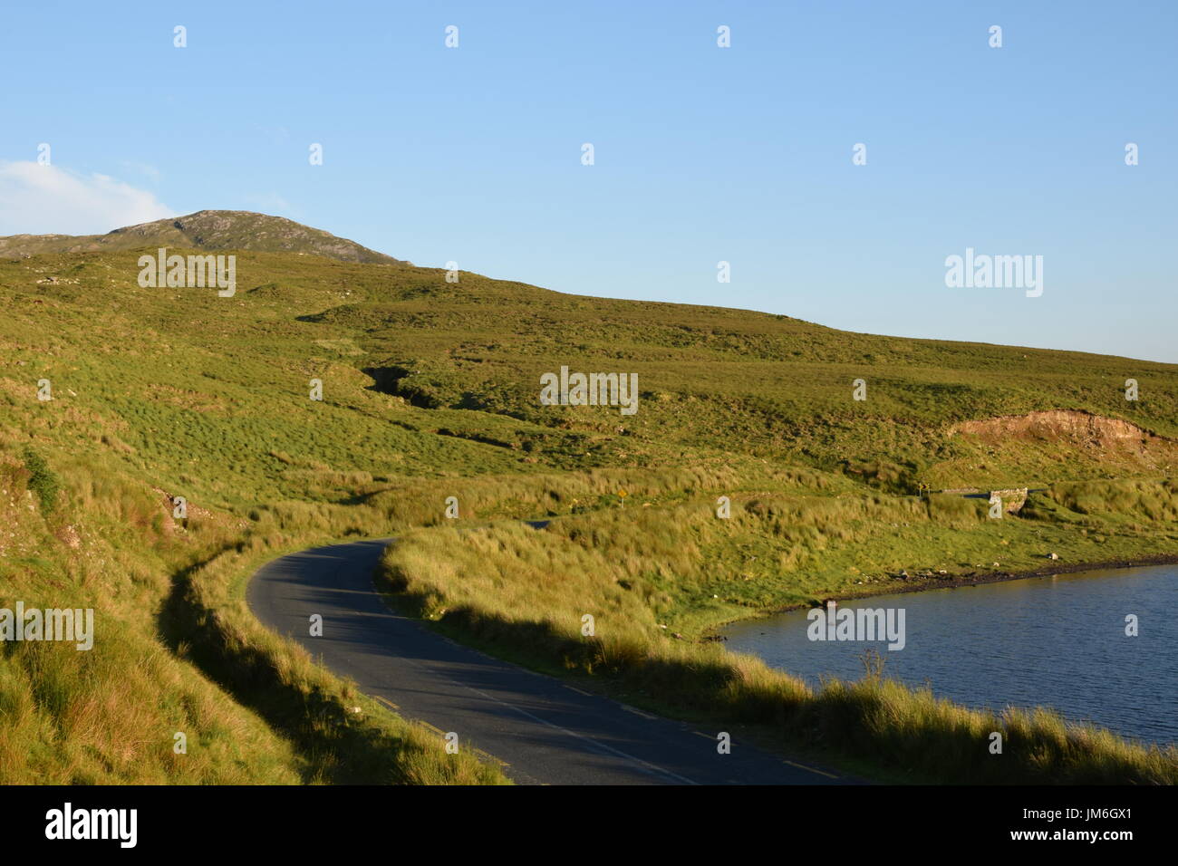 Road next to Lough Inagh lake, Connemara National Park, County Galway ...