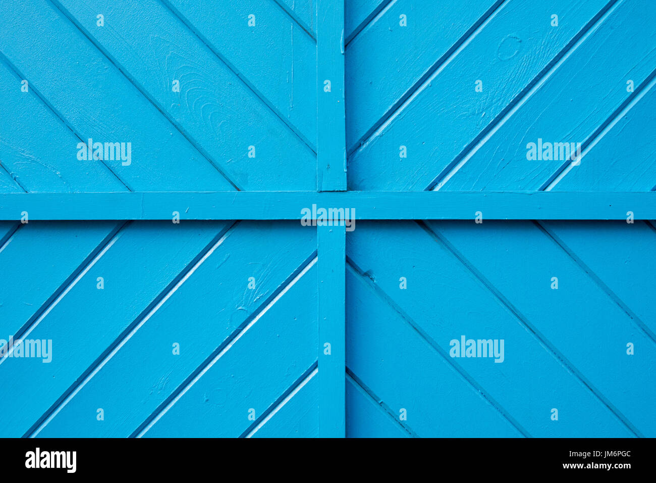 A blue wooden wall with quadrants and diagonal patterns Stock Photo - Alamy