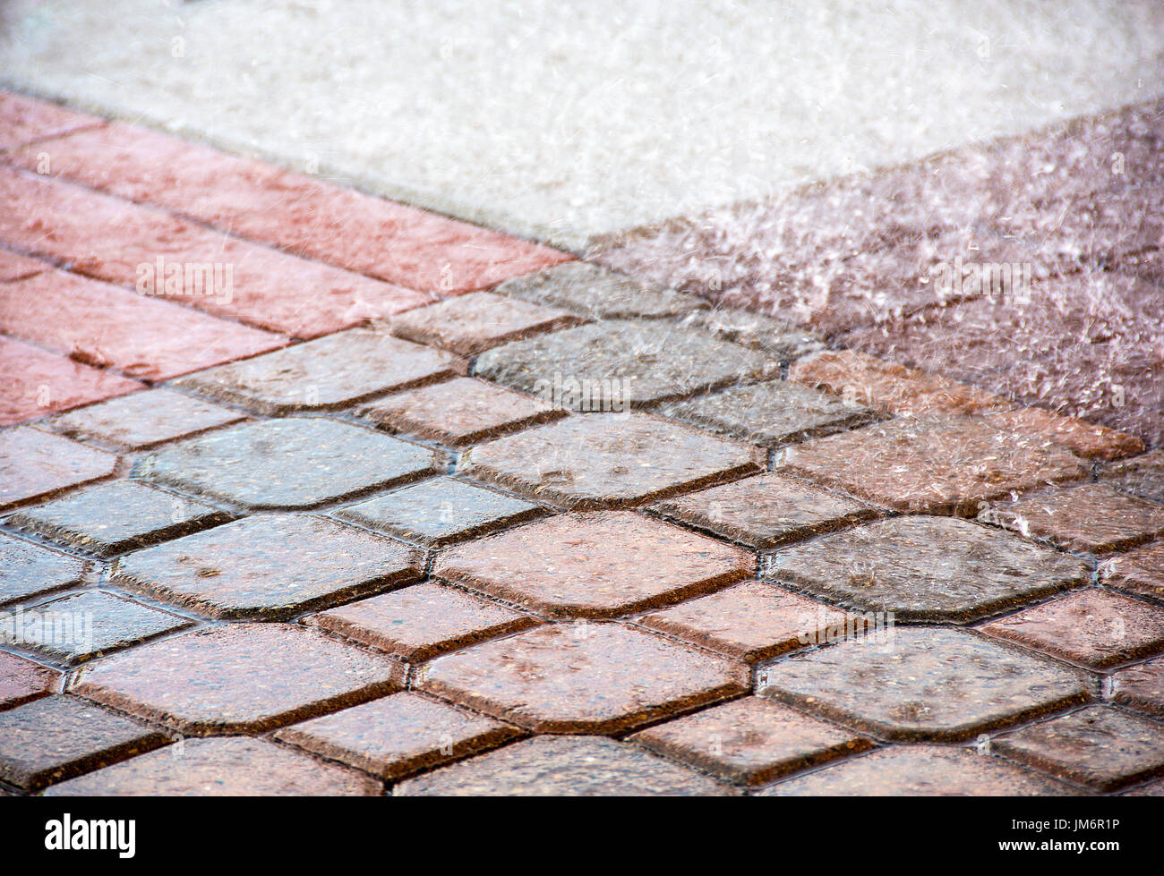 raindrops splashing on stone tile Stock Photo - Alamy