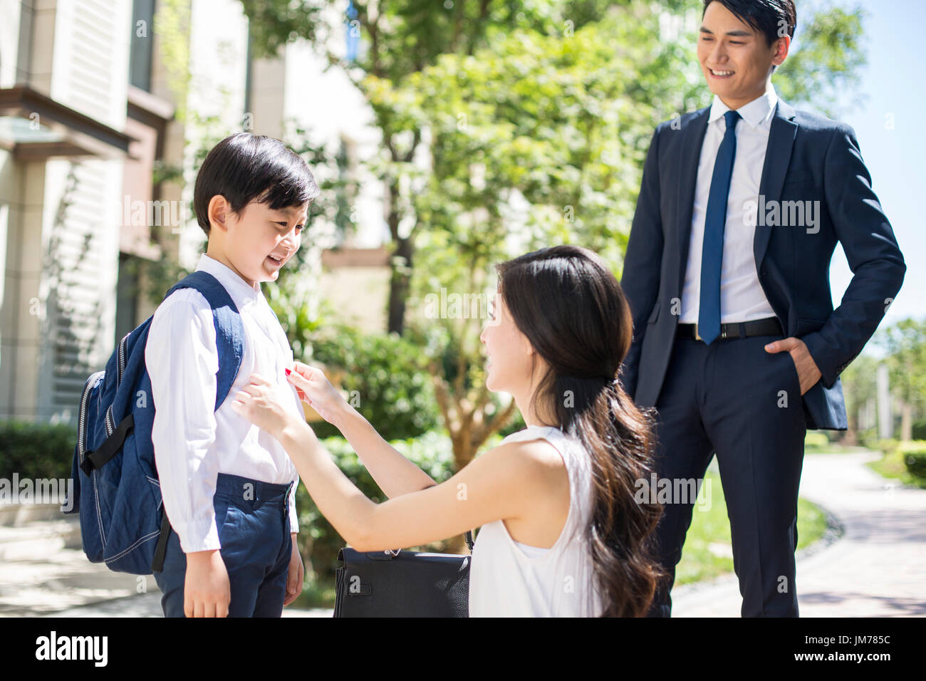 Chinese parents taking their child to school in the morning Stock Photo ...