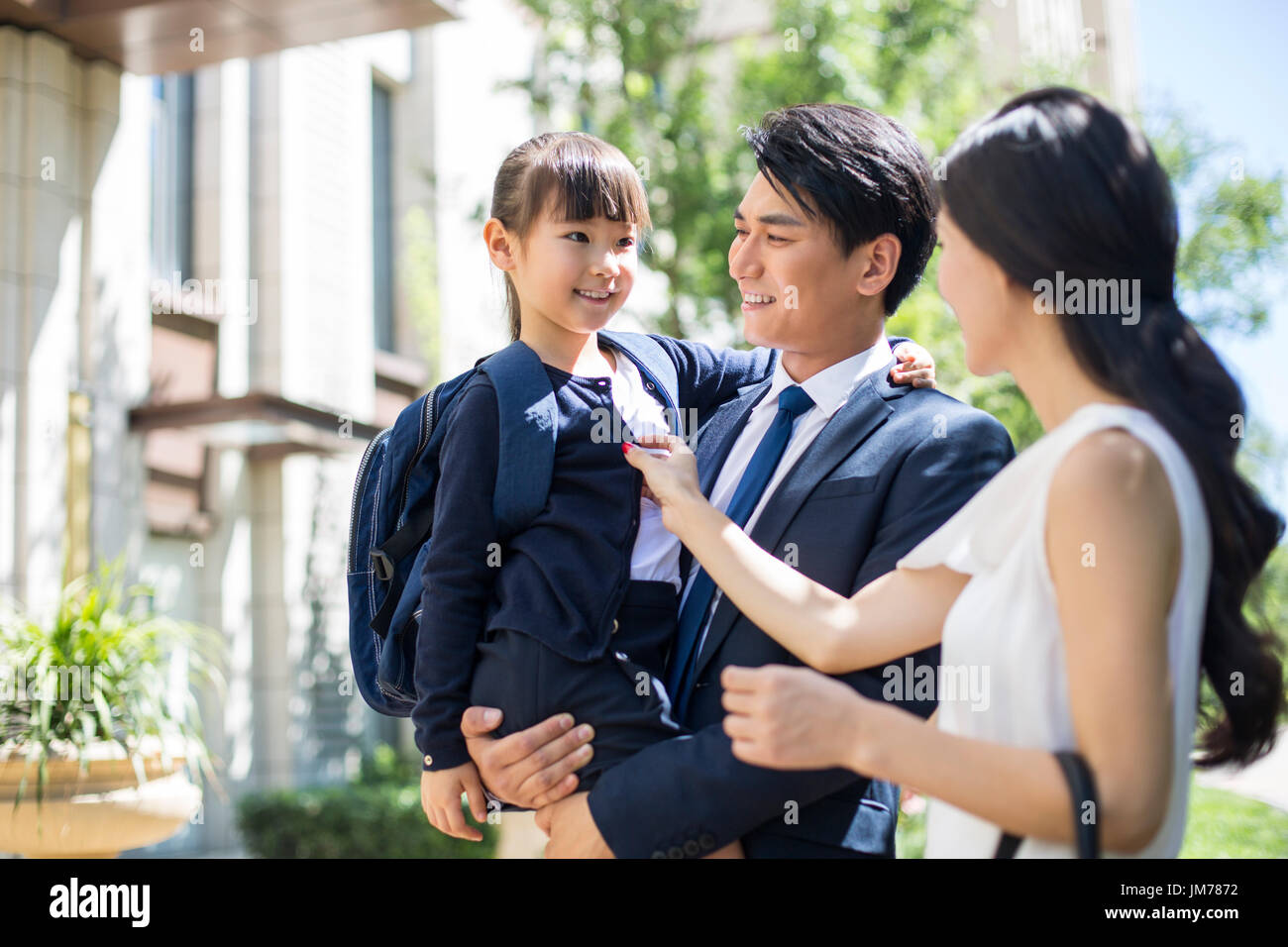 Chinese parents taking their child to school in the morning Stock Photo ...