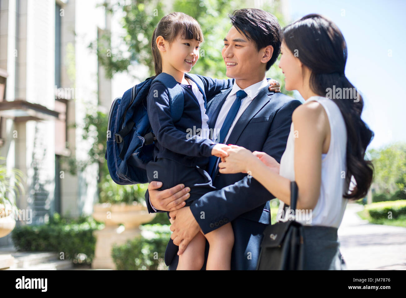 Chinese parents taking their child to school in the morning Stock Photo ...