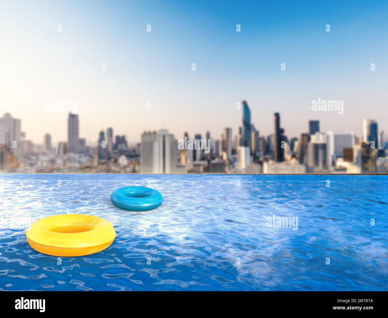 swim ring on infinity pool with cityscape background Stock Photo - Alamy