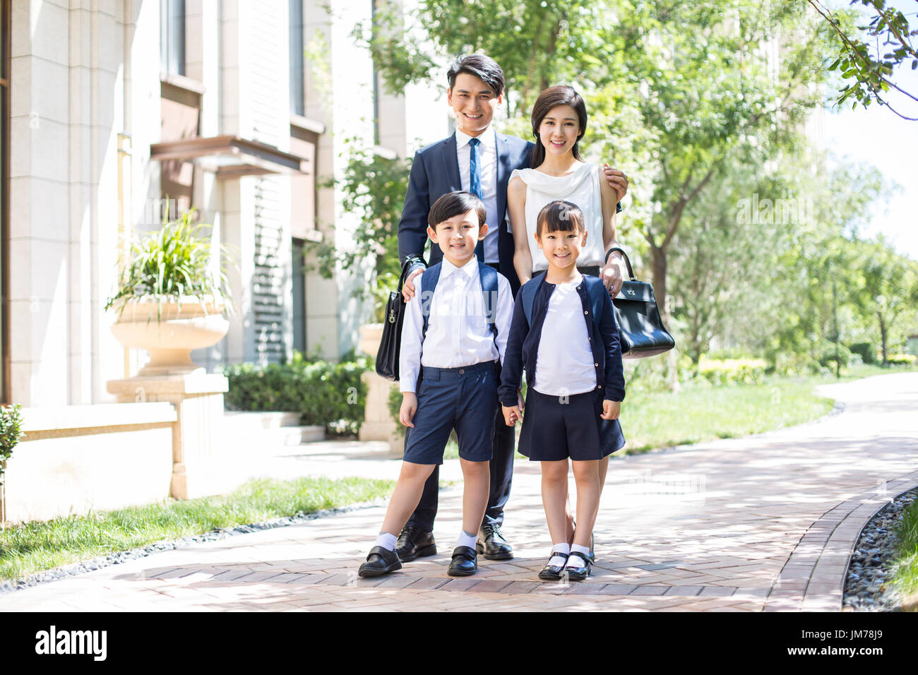 Portrait of happy young Chinese family Stock Photo - Alamy