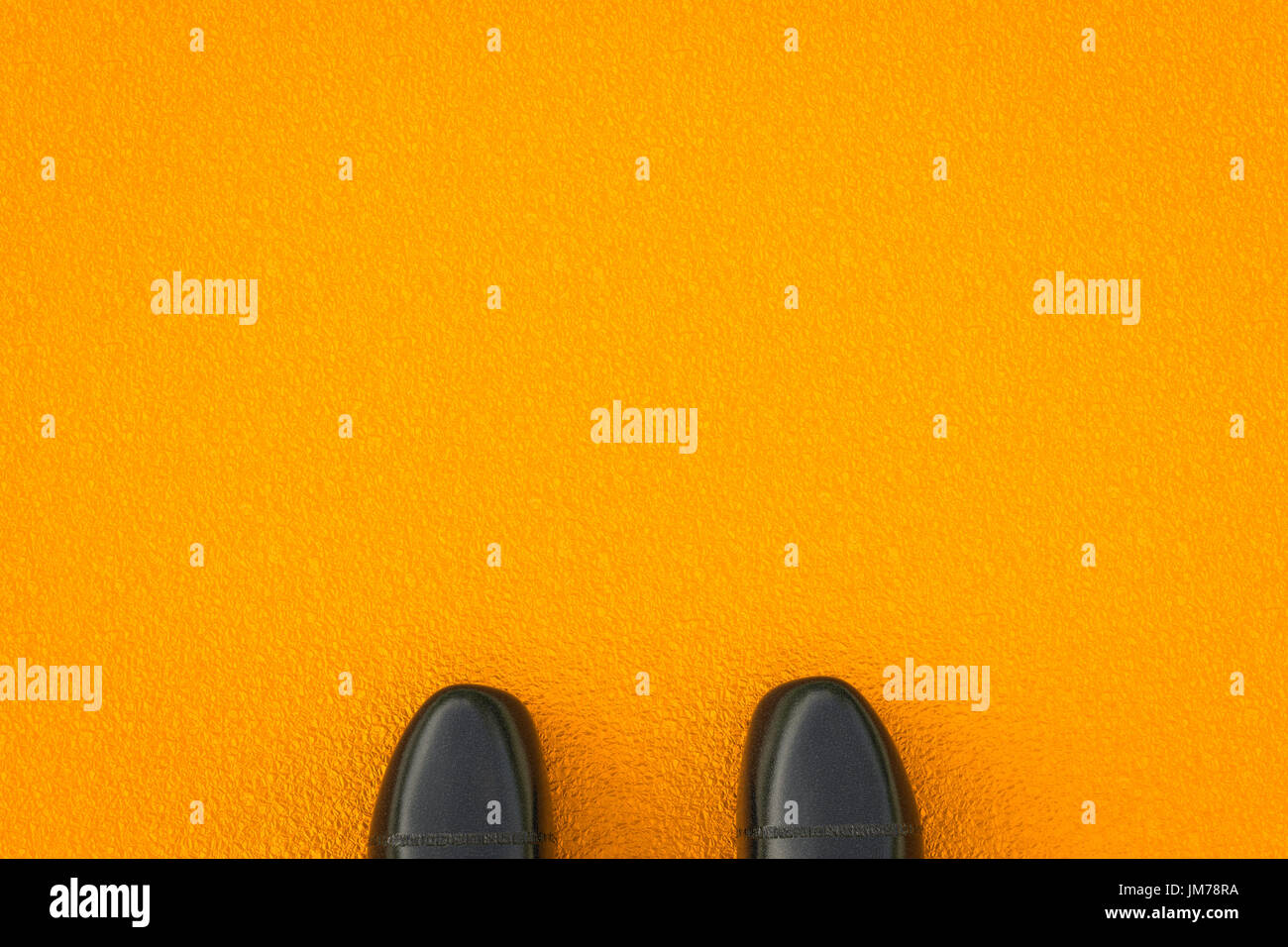 3d rendering black leather shoes on yellow background Stock Photo - Alamy