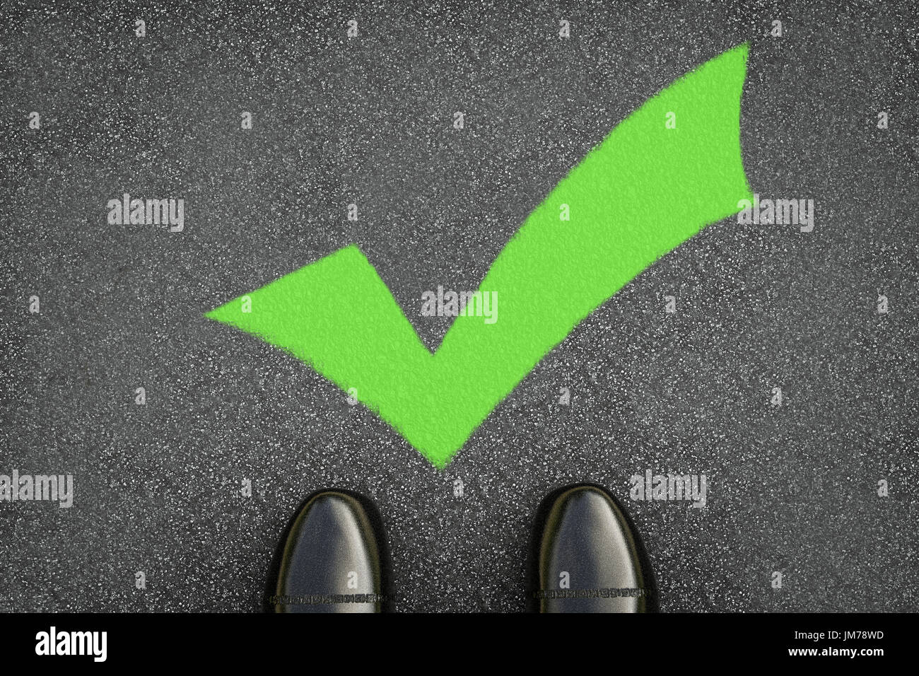 right way concept with green checkmark on street Stock Photo - Alamy