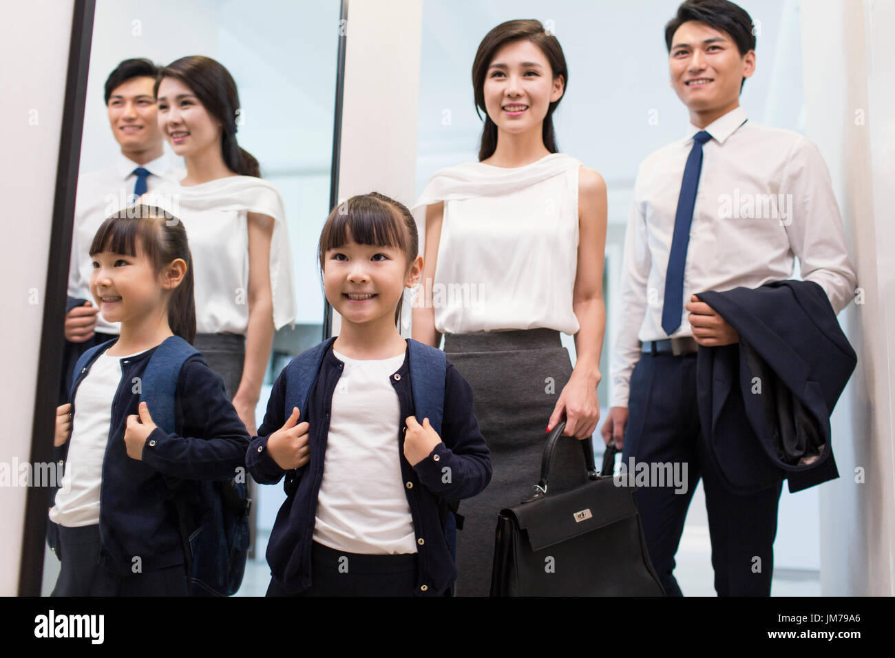 Chinese parents taking their child to school in the morning Stock Photo ...