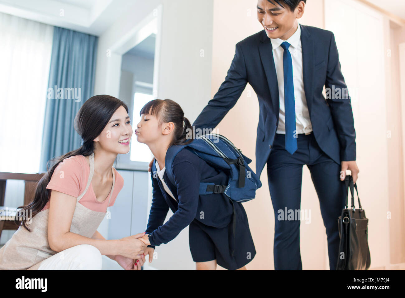 Happy young Chinese family Stock Photo - Alamy