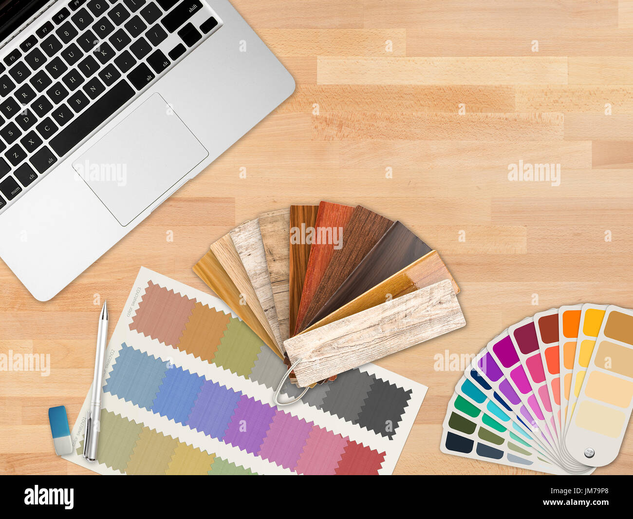 top view designer workspace with computer notebook and color guide ...
