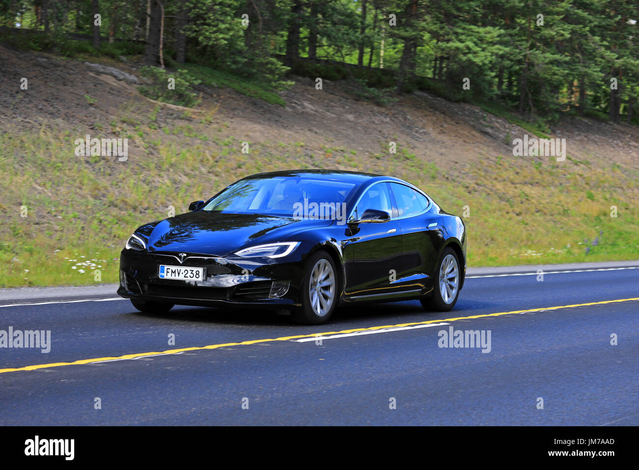 NUMMELA, FINLAND - JULY 21, 2017: Black Tesla Model S luxury sedan with ...