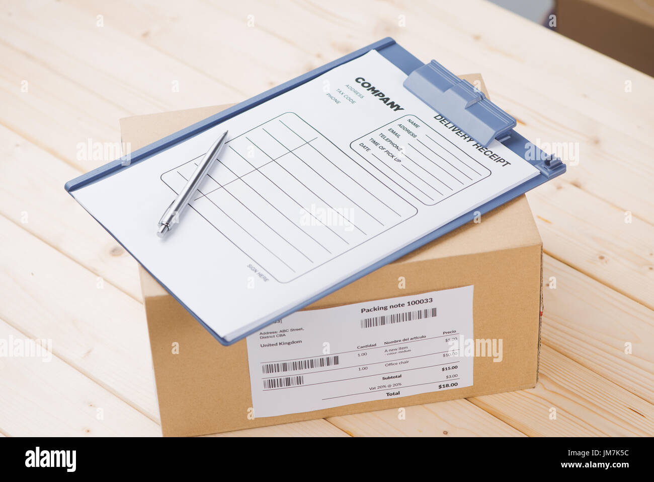 Delivery receipt on cardboard box at table Stock Photo - Alamy