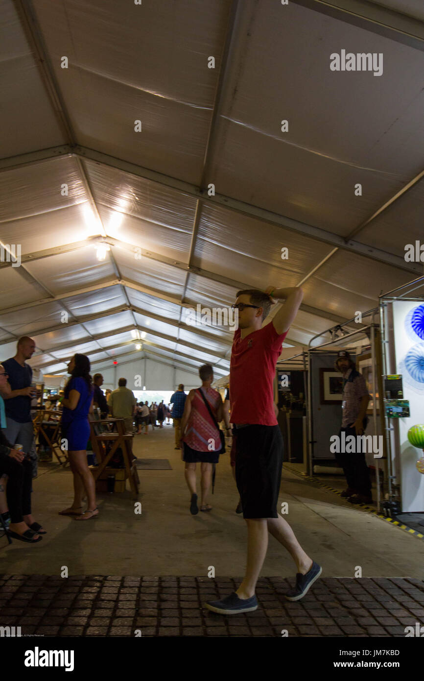 walking through a crow with arms stretched over his head Stock Photo ...