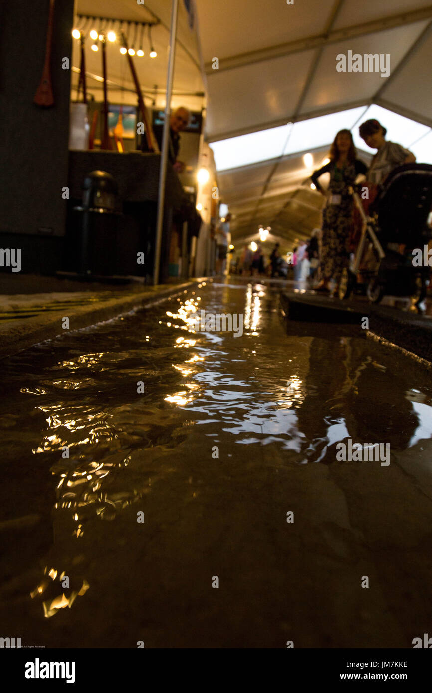 silhouette of people in a rain soaked tent Stock Photo - Alamy