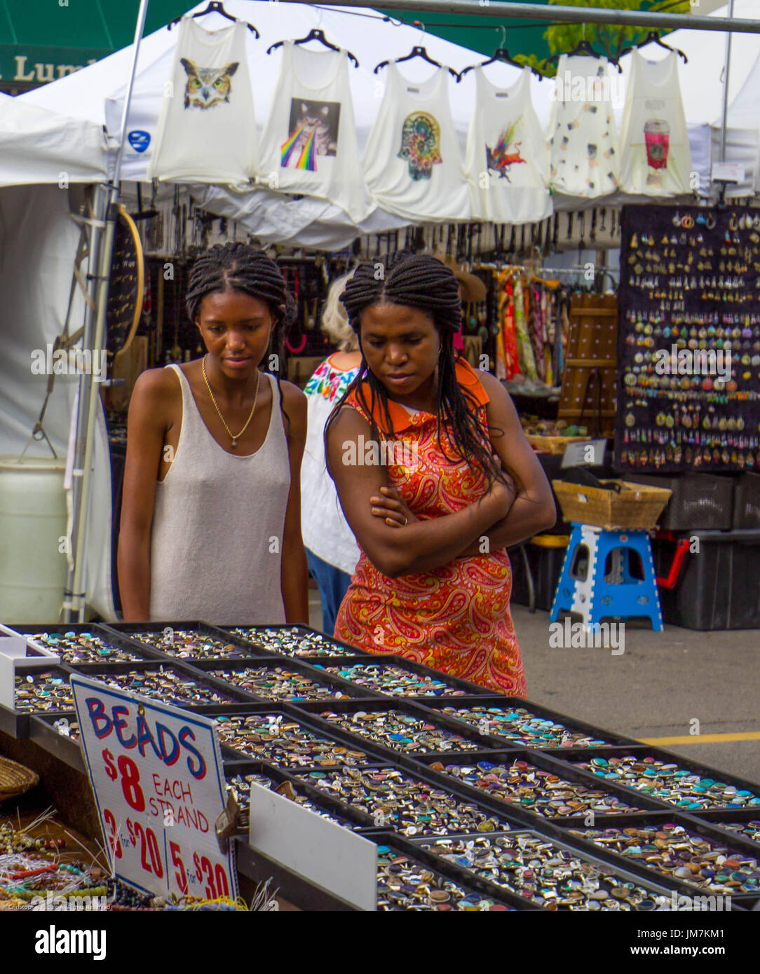 Two woman shopping for beads Stock Photo - Alamy