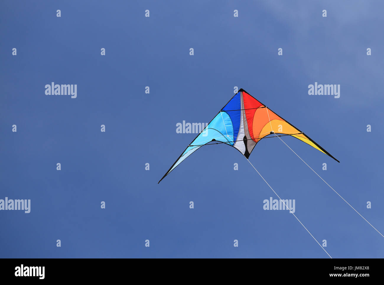 Colorful kite in blue sky. Kite on summer sky background close-up Stock ...