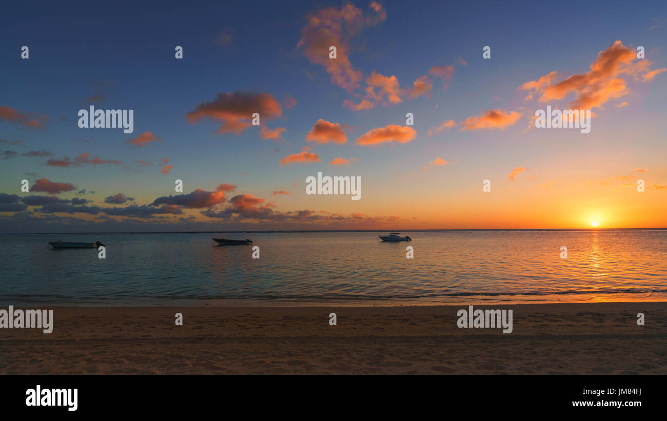 Amazing sunset at Mauritius panorama,Fishing boat at sunset time Stock ...