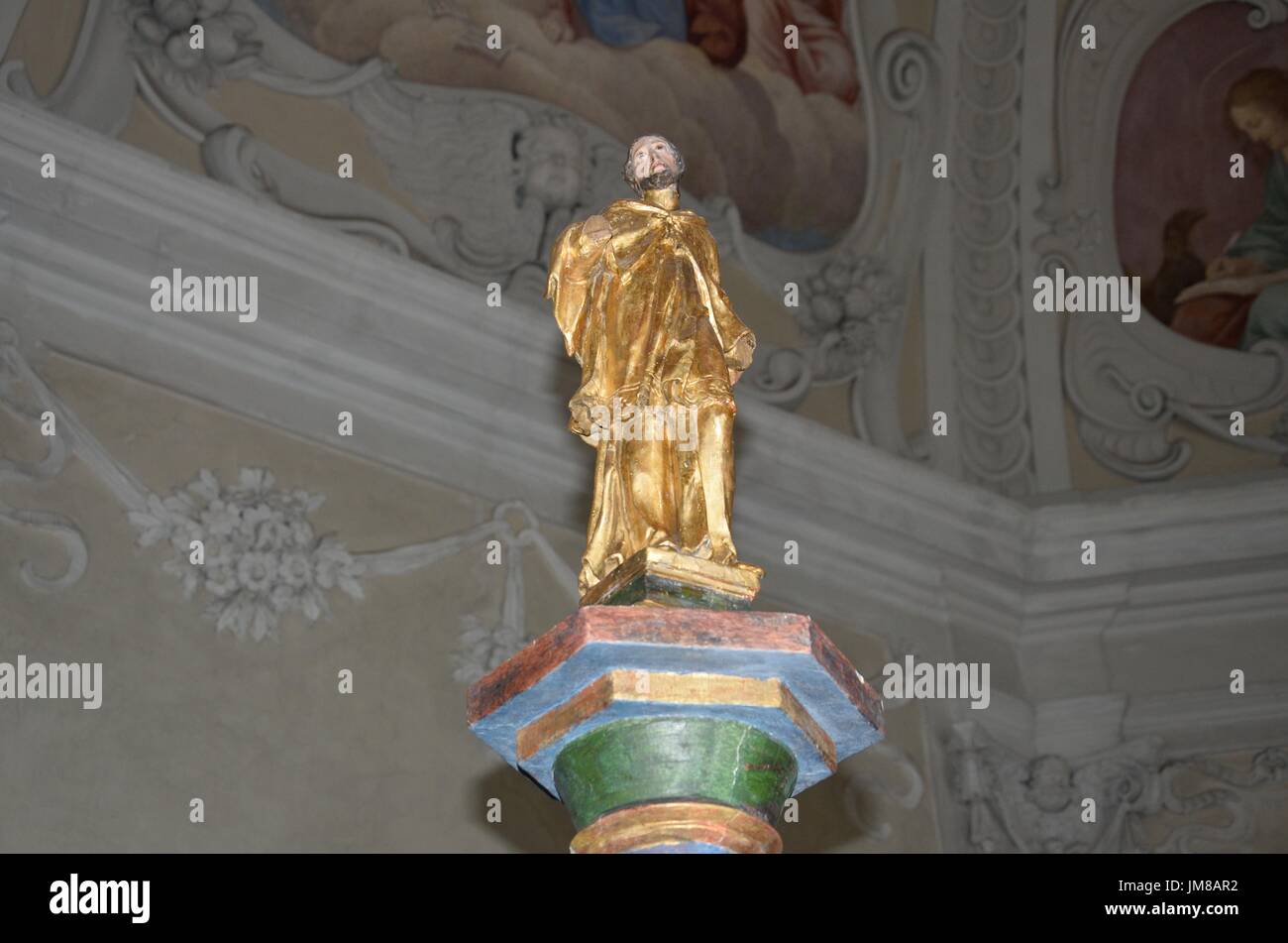 Small Gold figure of saint Stock Photo - Alamy