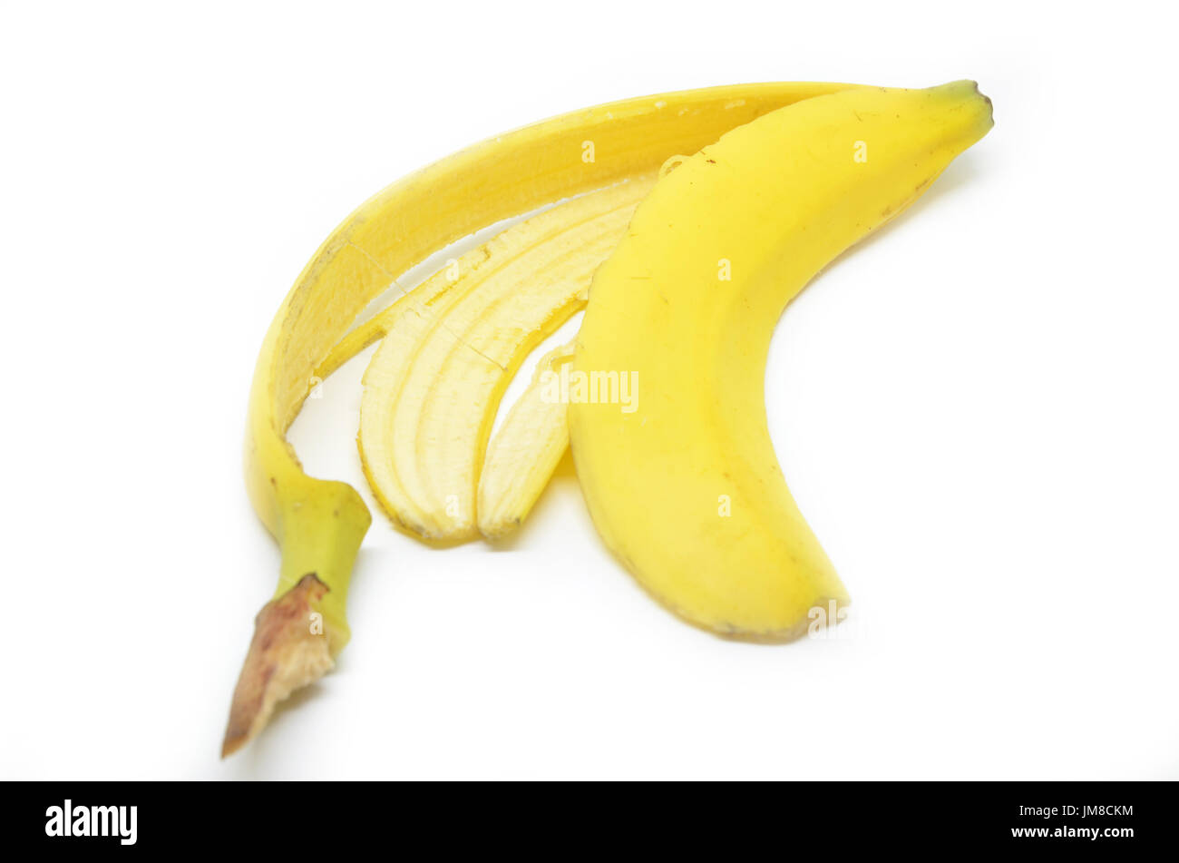 Slippery banana skin on a white background Stock Photo - Alamy