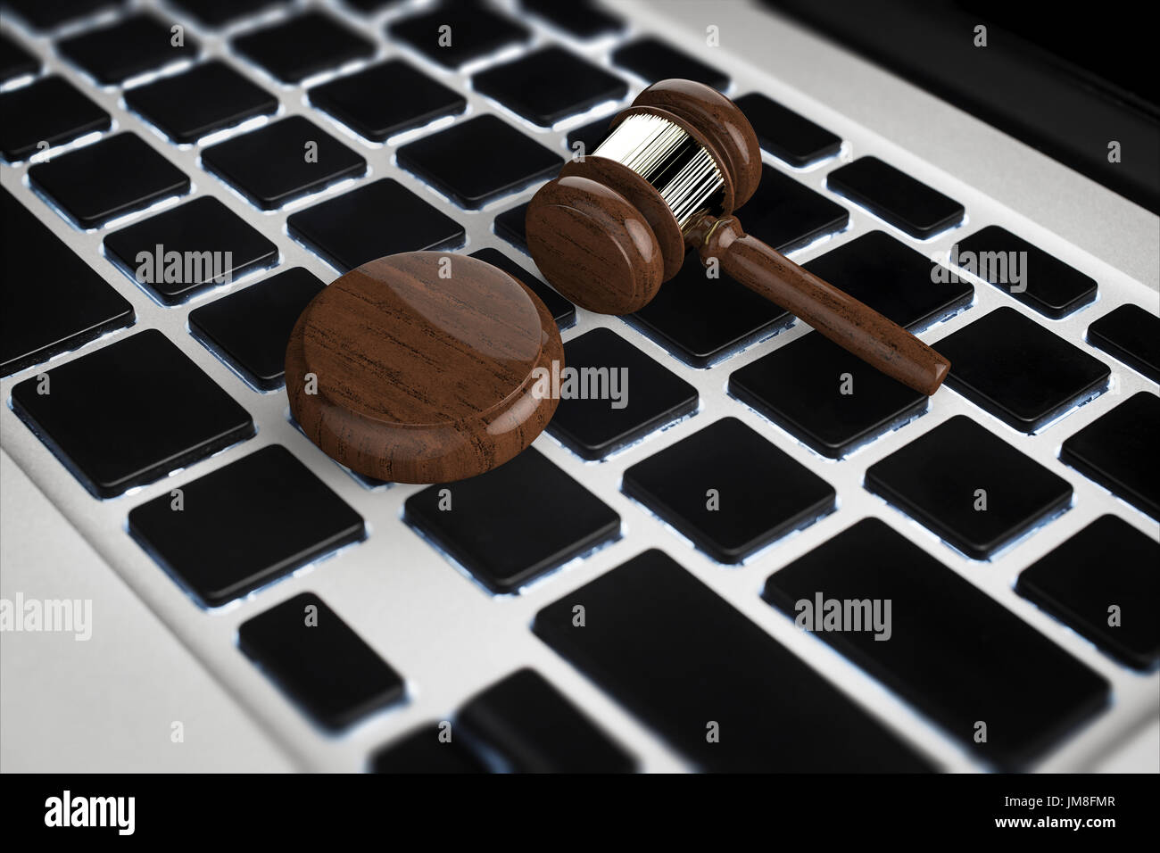 cyber law concept with 3d rendering gavel judge on computer keyboard ...